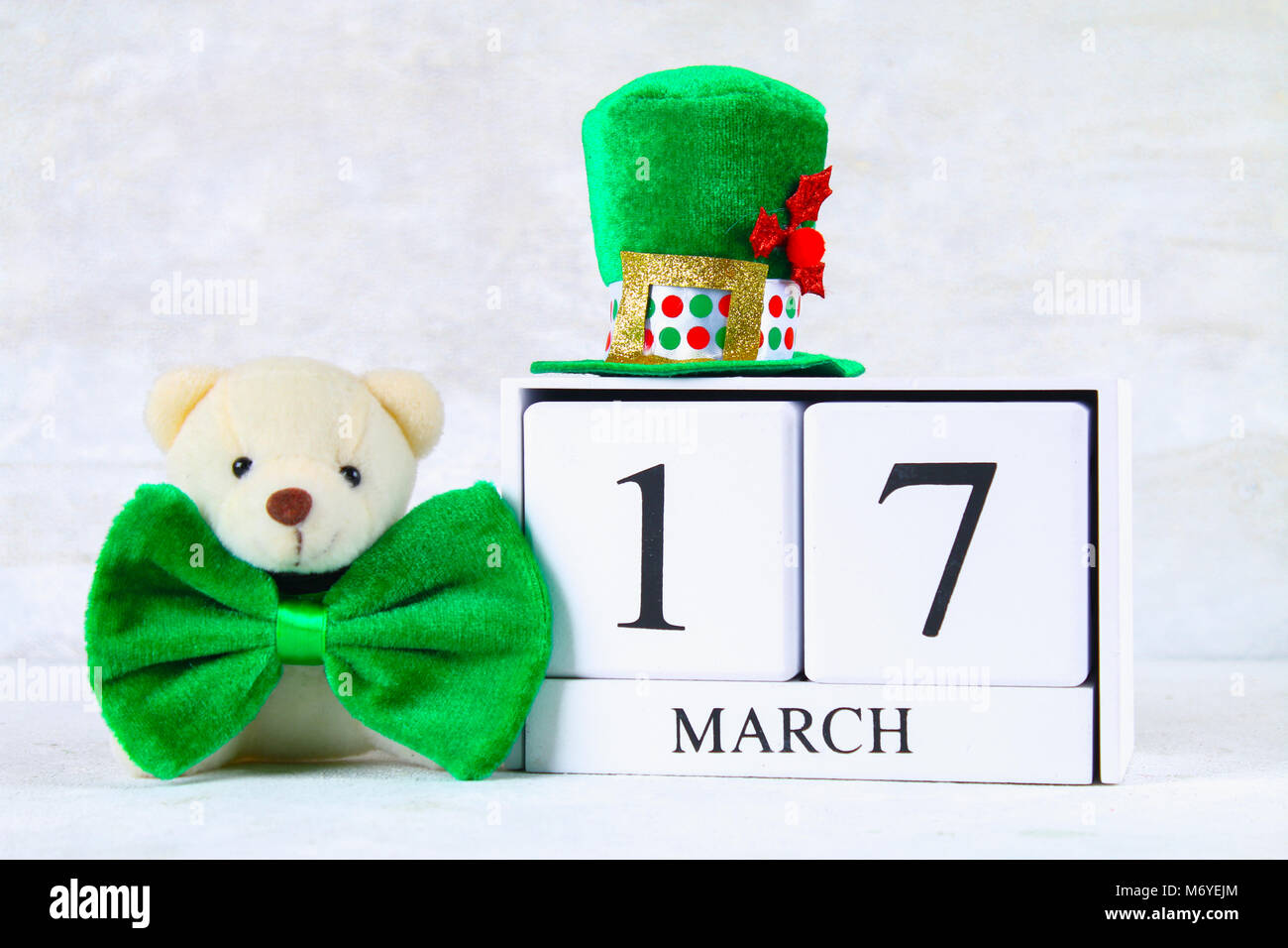 St.Patrick 's Day. A wooden calendar showing March 17. Green hat and ...