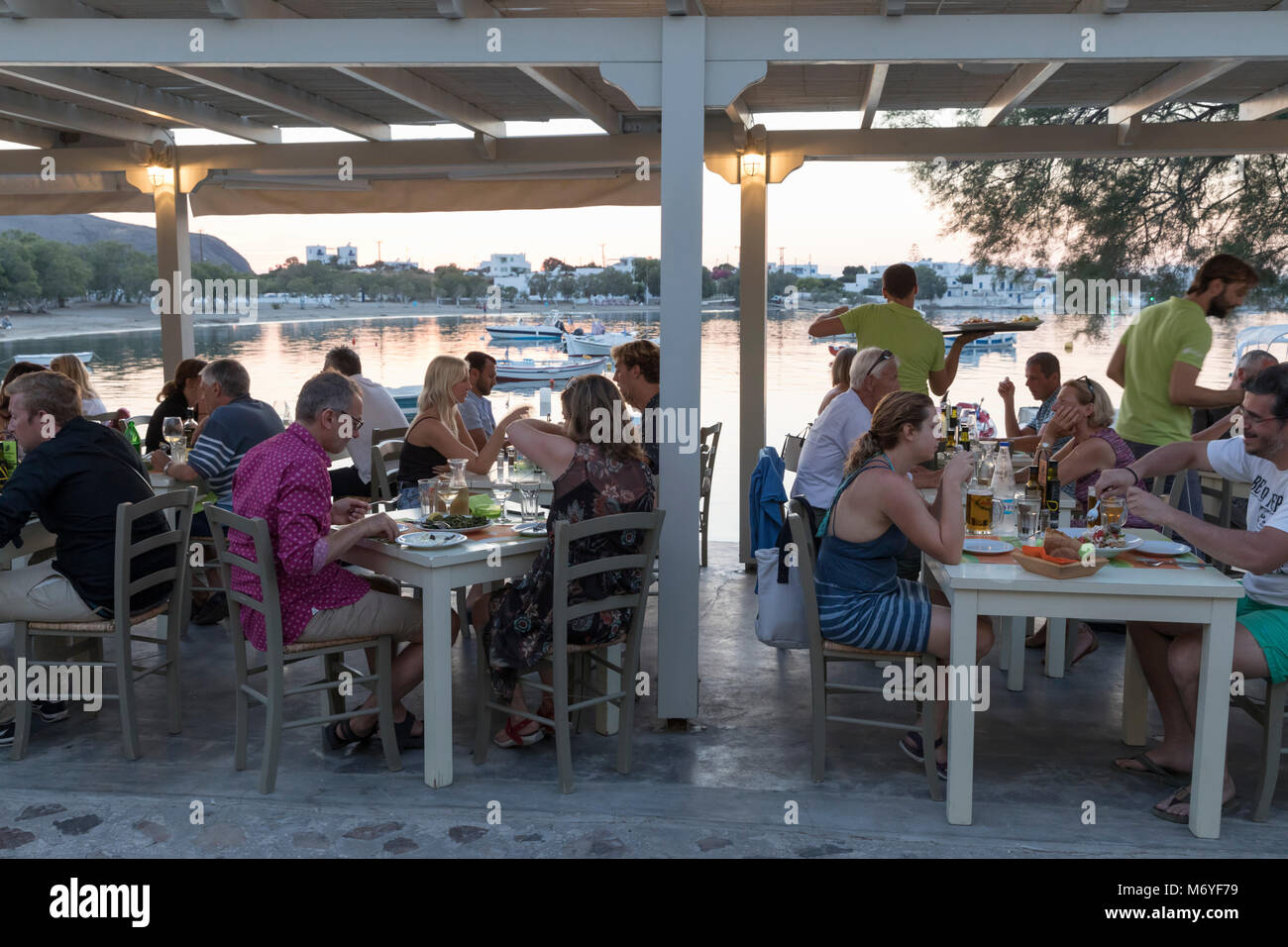 Harbour restaurant in evening, Pollonia, Milos, Cyclades, Aegean Sea ...
