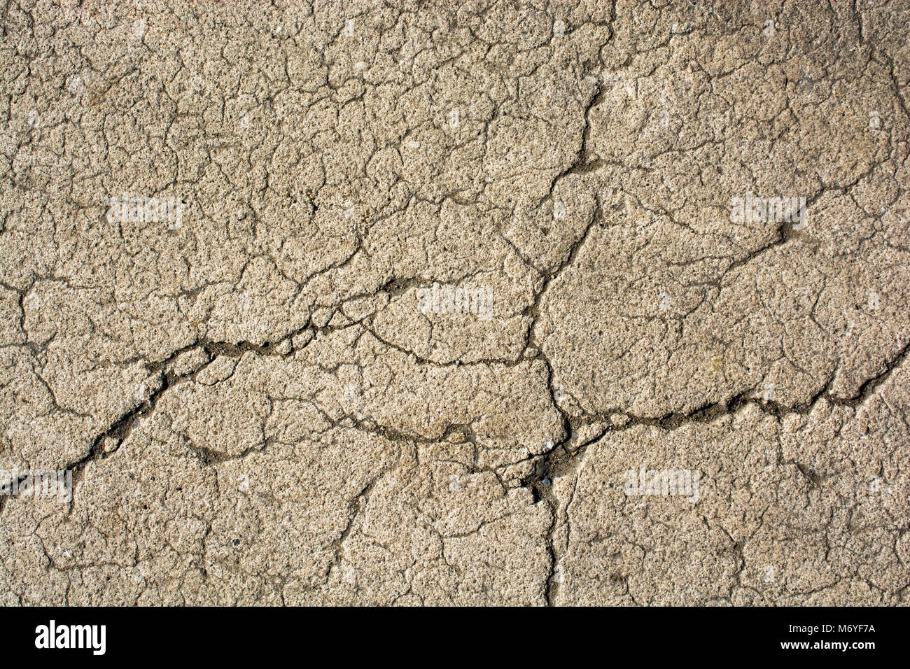 Cracked concrete surface as a background texture pattern Stock Photo ...