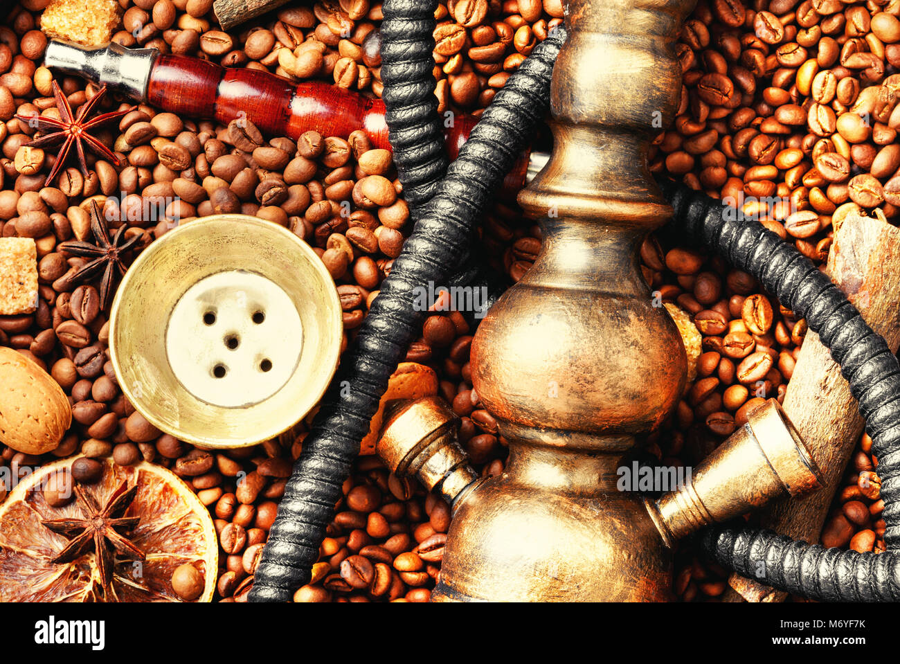 Smoke hookah with with coffee beans and pomegranate.Shisha concept ...