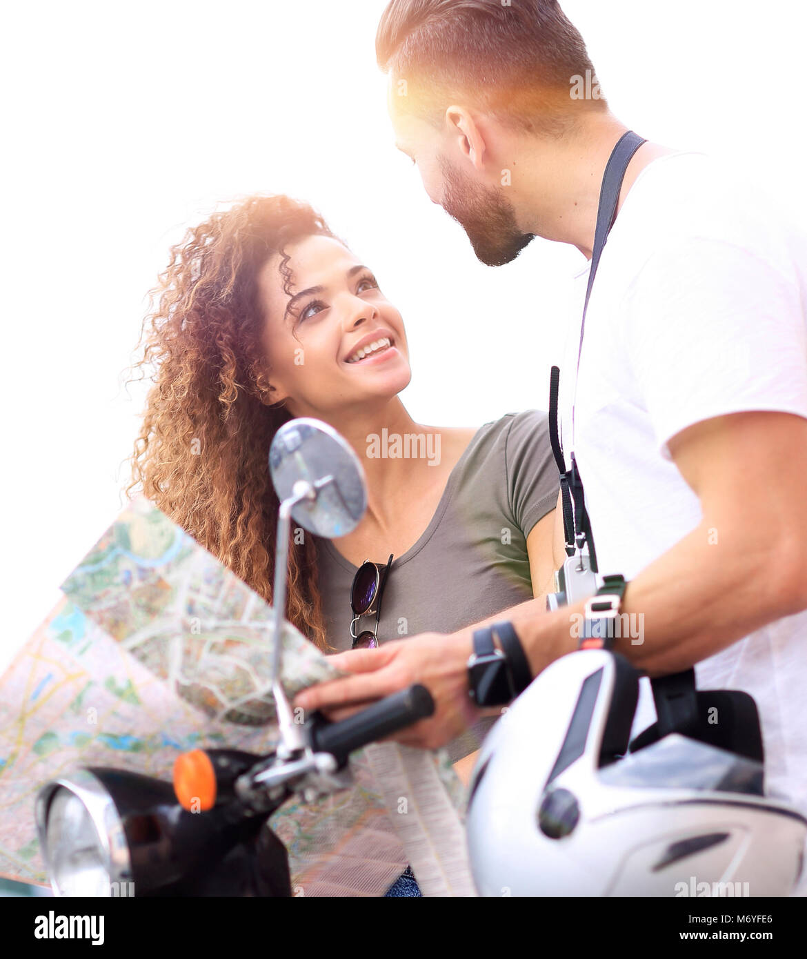 Couple riding motor scooter in old city street Stock Photo - Alamy