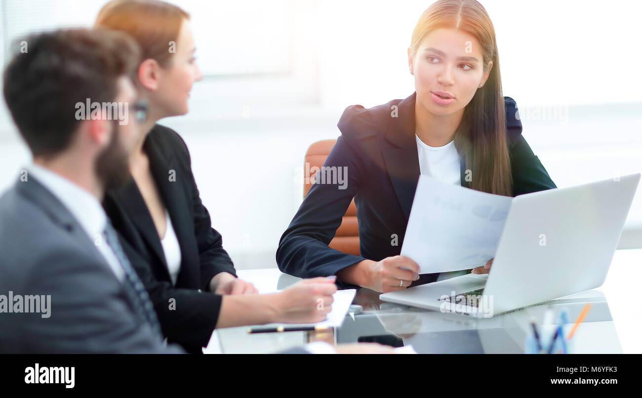business partners discussing documents and ideas at meeting Stock Photo ...