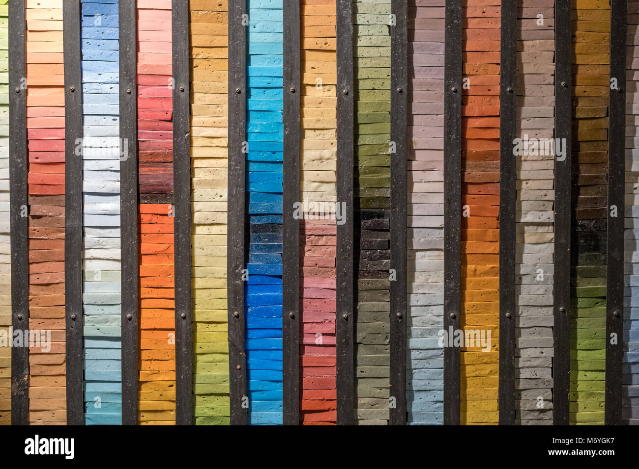 Brightly coloured glass mosaic samples in a frame, seen in Orsoni glass ...