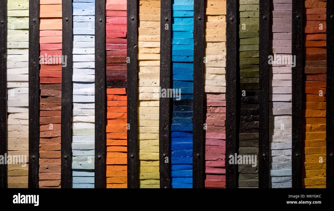 Brightly coloured glass mosaic samples in a frame, seen in Orsoni glass ...