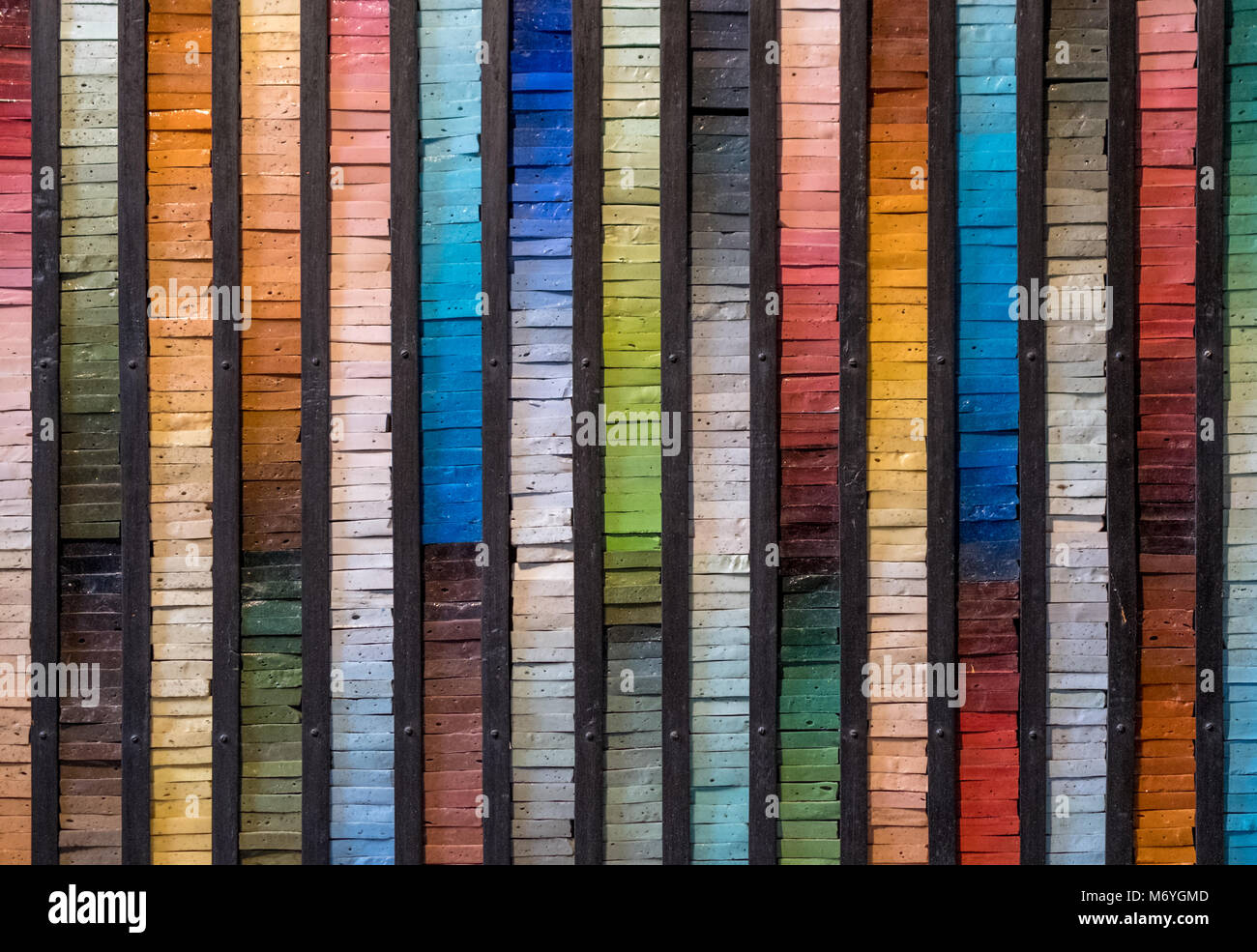 Brightly coloured glass mosaic samples in a frame, seen in Orsoni glass ...