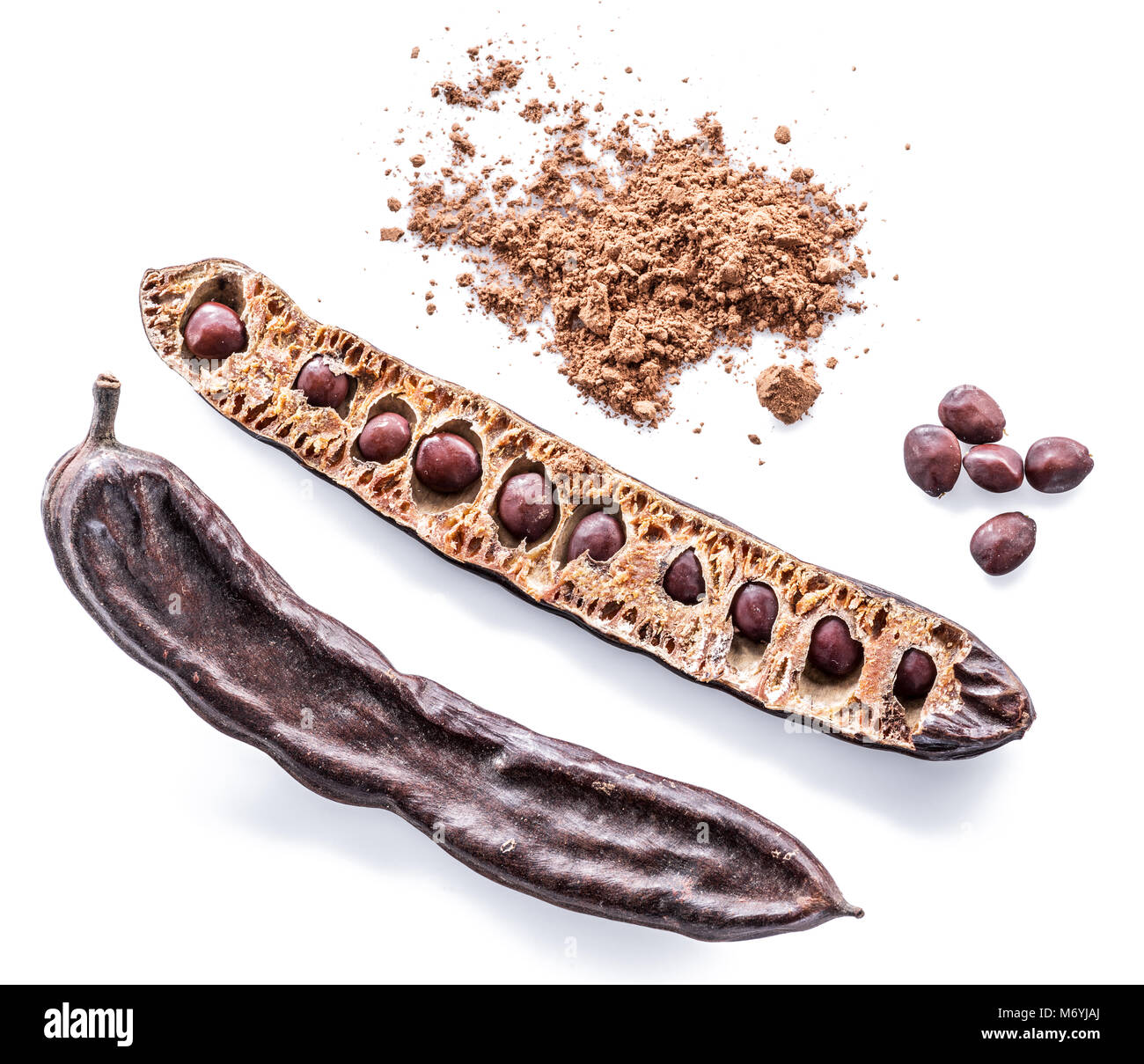 Carob pods and carob powder on the white background Stock Photo - Alamy