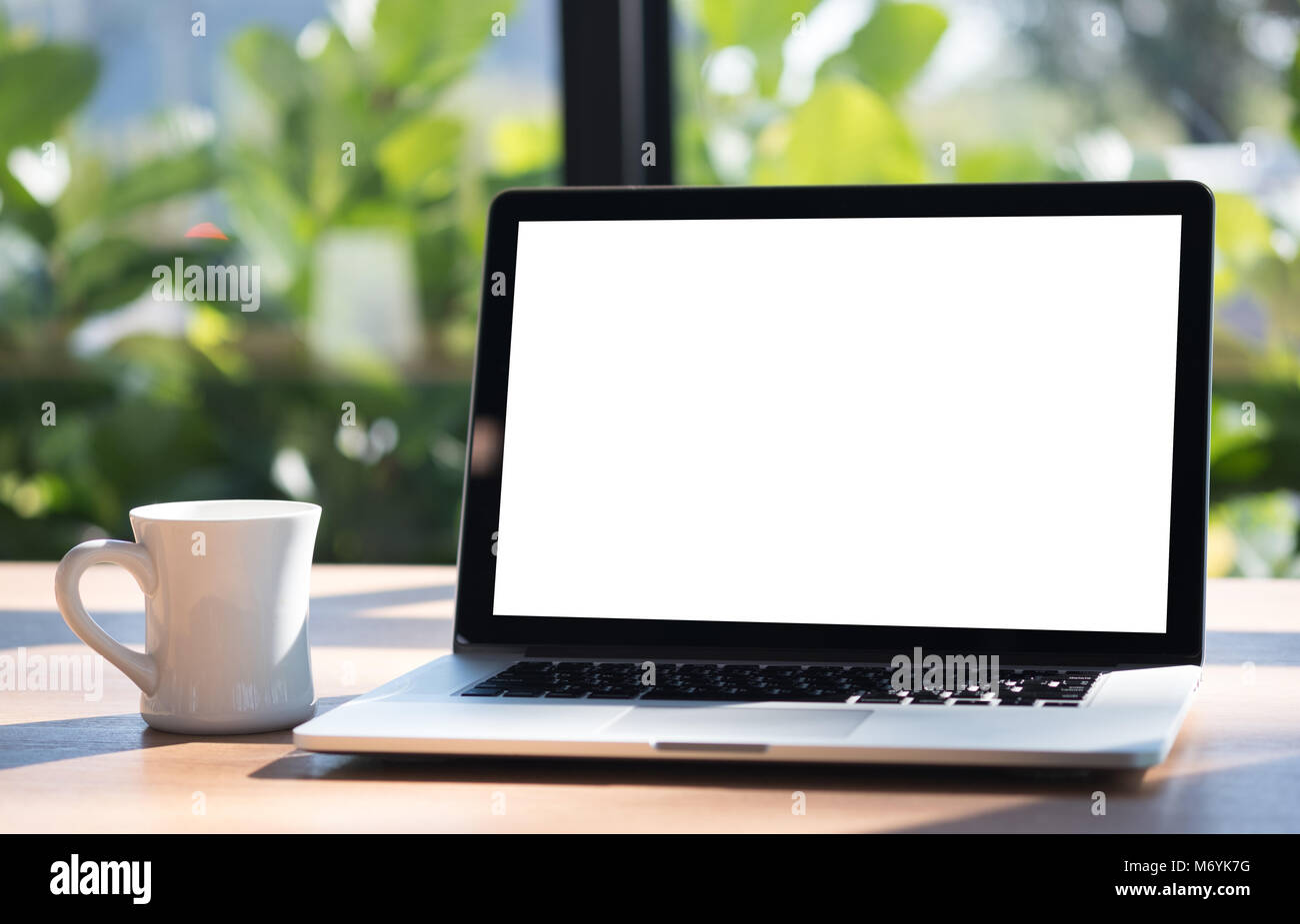 Laptop with blank screen on table. Workspace background new project on ...