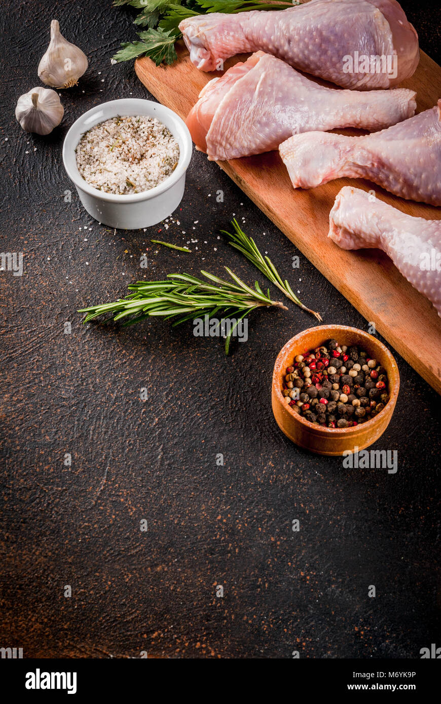 Raw chicken drumsticks rosemary hi-res stock photography and images - Alamy