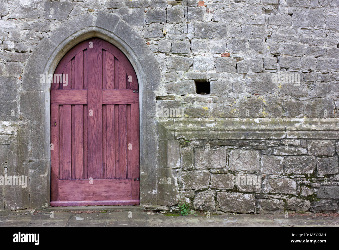 Old purple gothic church back door Stock Photo - Alamy