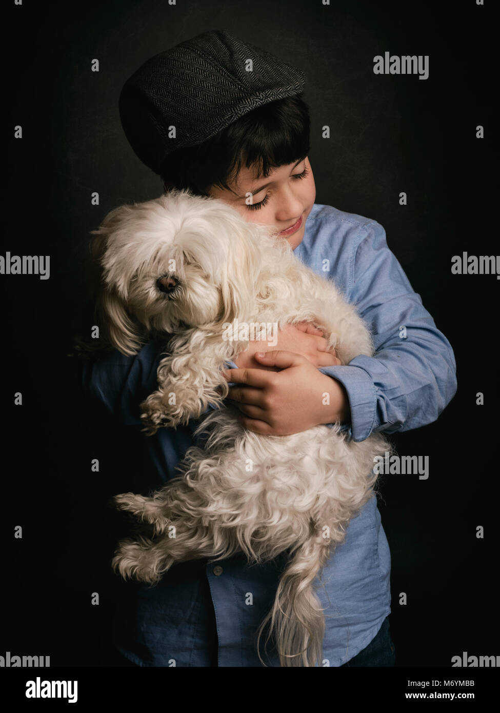 boy hugging his dog on black background boy hugging his dog on black ...