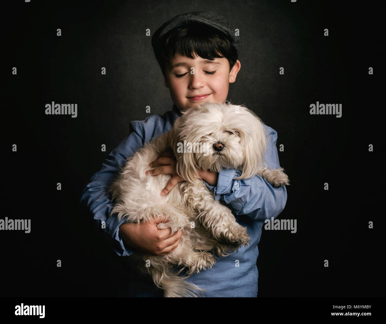boy hugging his dog on black background boy hugging his dog on black ...