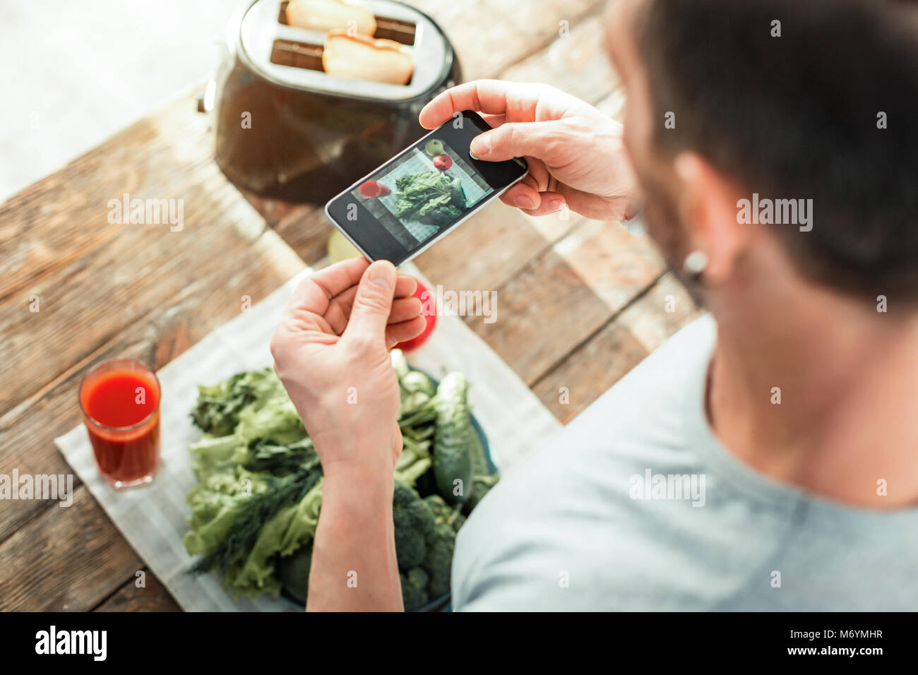Multitasking functional smartphone being in mans hands Stock Photo - Alamy