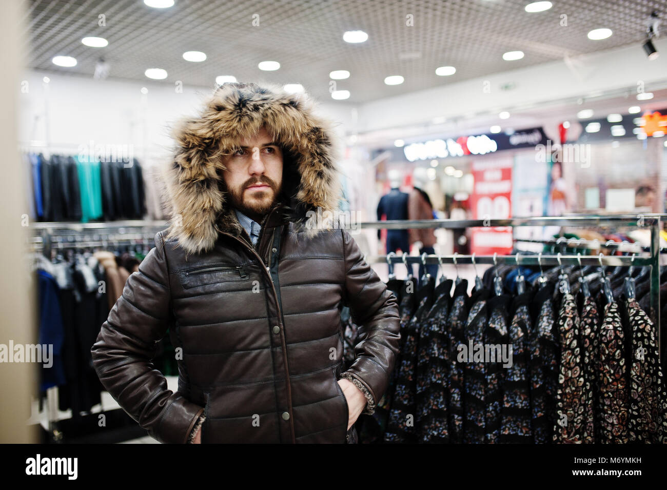 Stylish turkish man at the store of fur coats and leather jackets ...