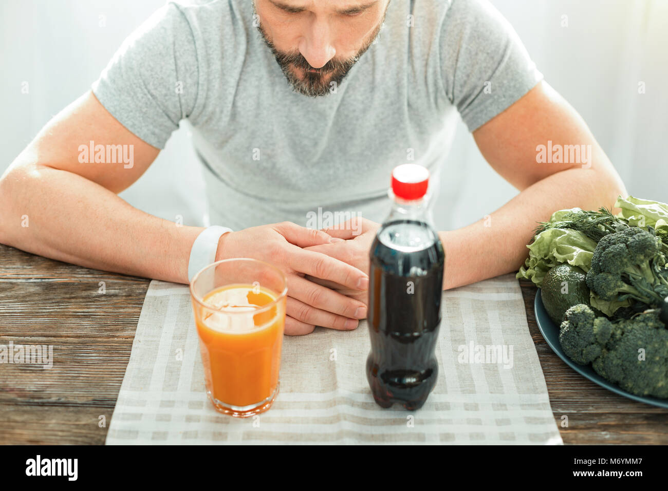 Colorful cold drinks being opposite a man Stock Photo - Alamy
