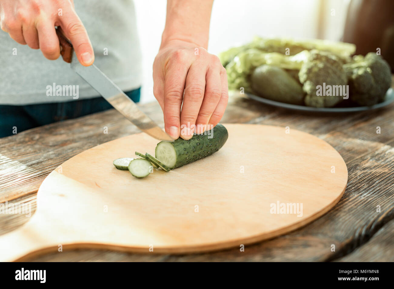 Natural cucumber being cutting Stock Photo - Alamy