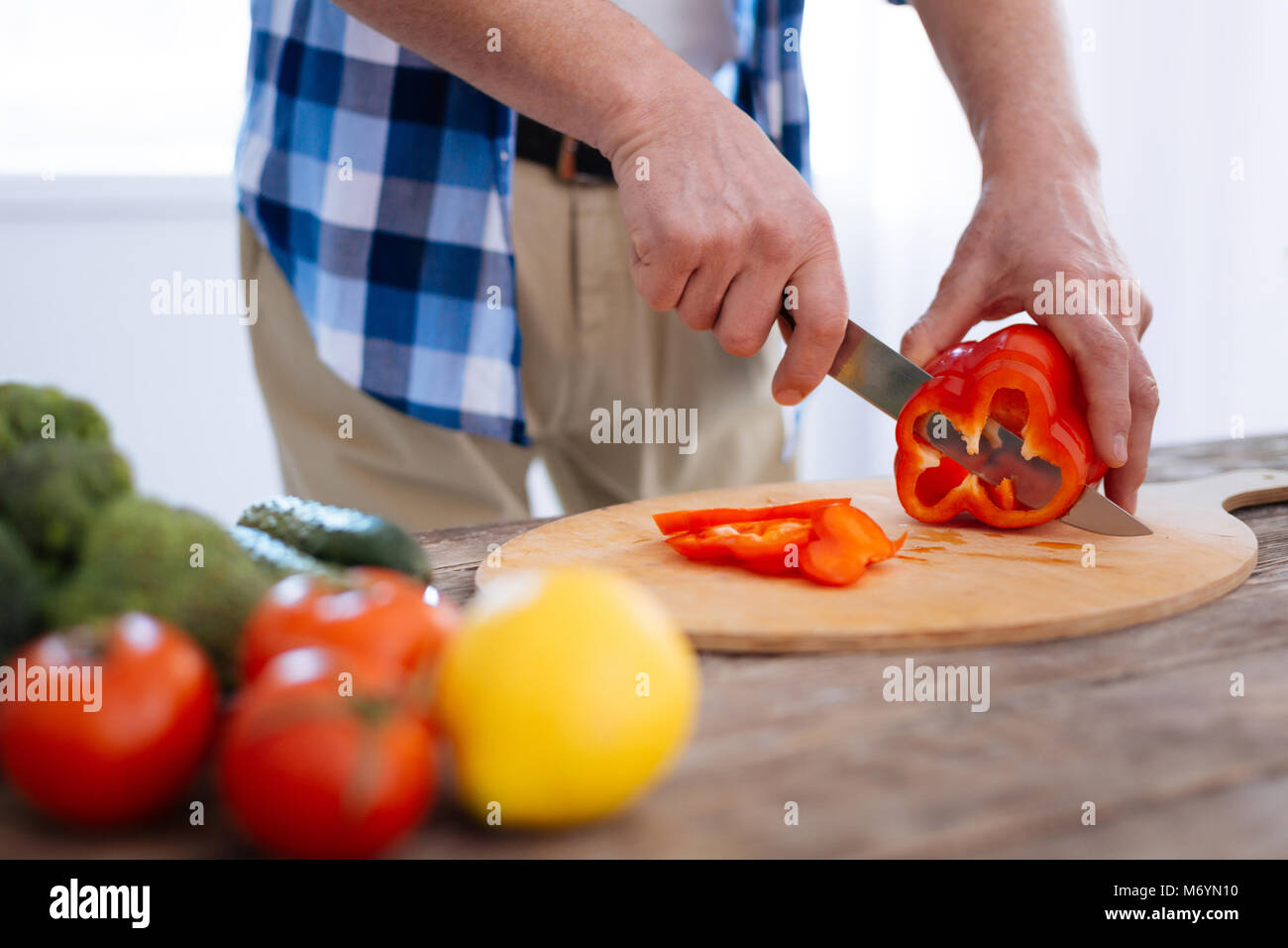 Male young hands chopping vegetable Stock Photo - Alamy