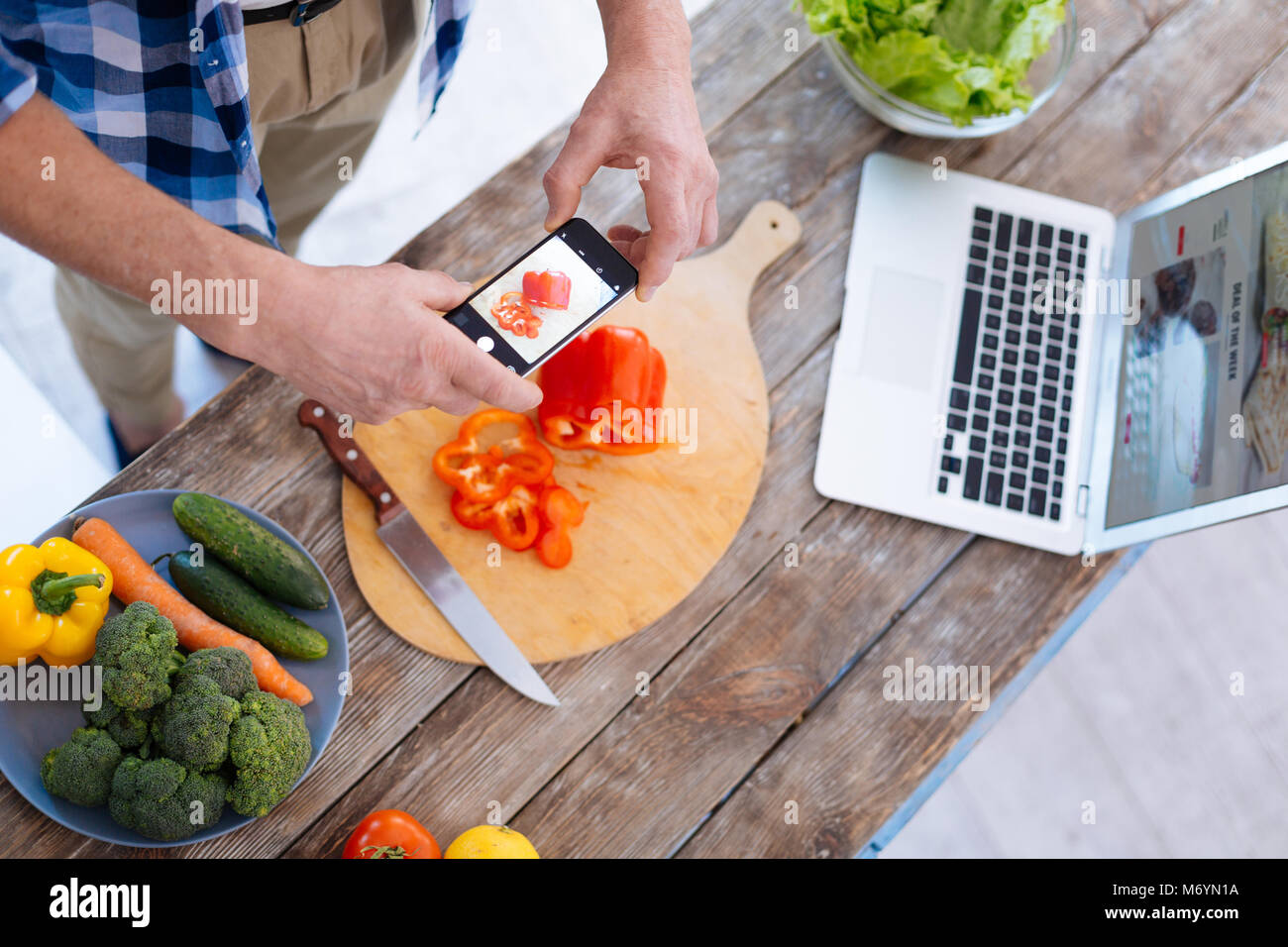 Young male hands filming food Stock Photo - Alamy