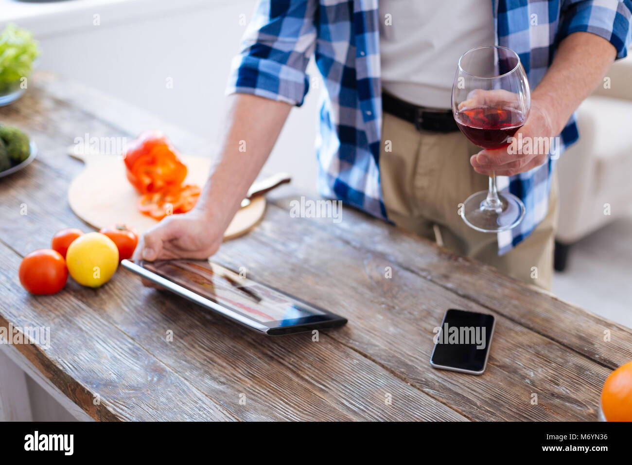 Male hand taking advanced tablet Stock Photo - Alamy