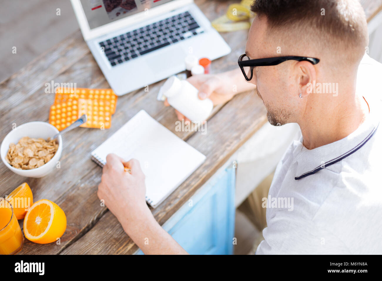 Man with supplements hi-res stock photography and images - Alamy
