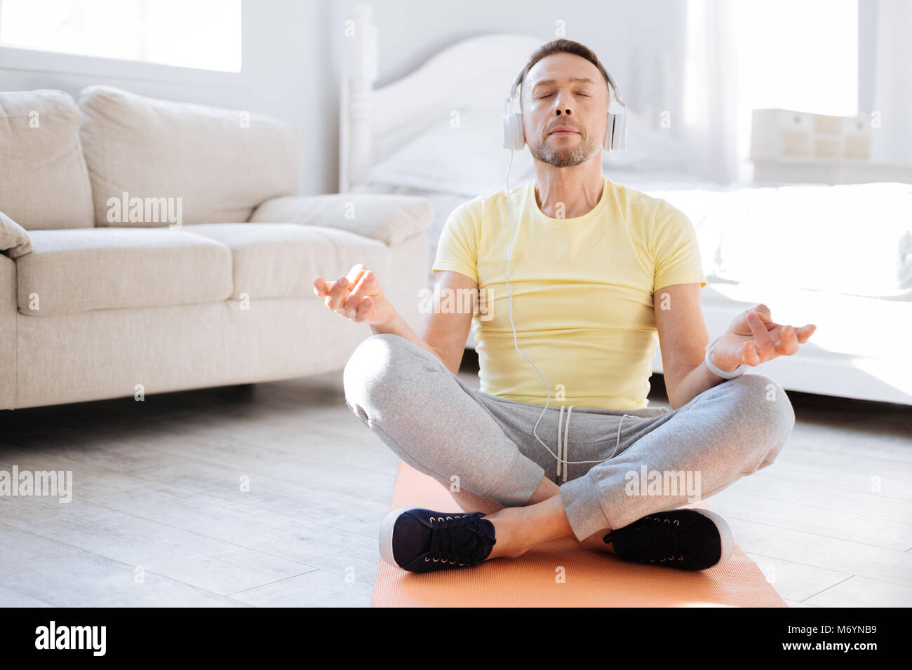 Calm collected man listening to music Stock Photo - Alamy