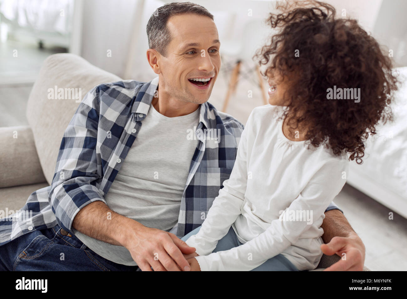 Alert father talking with his daughter Stock Photo - Alamy