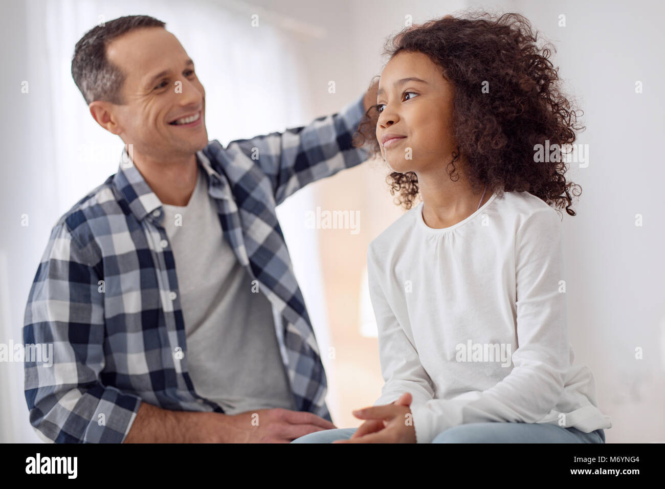 Smiling daddy caressing his daughter Stock Photo - Alamy