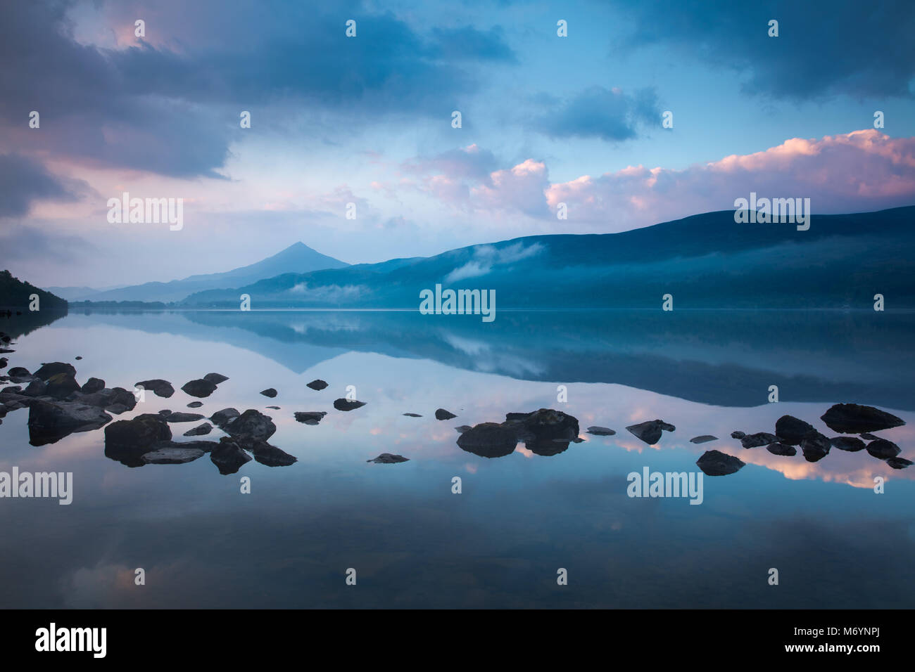 Schiehallion reflected in Loch Rannoch at dawn, Perthshire, Scotland ...