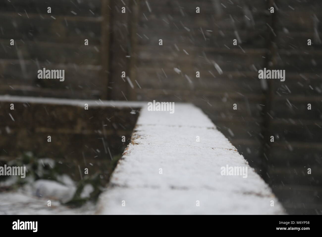 Winter snowfall brick wall hi-res stock photography and images - Alamy