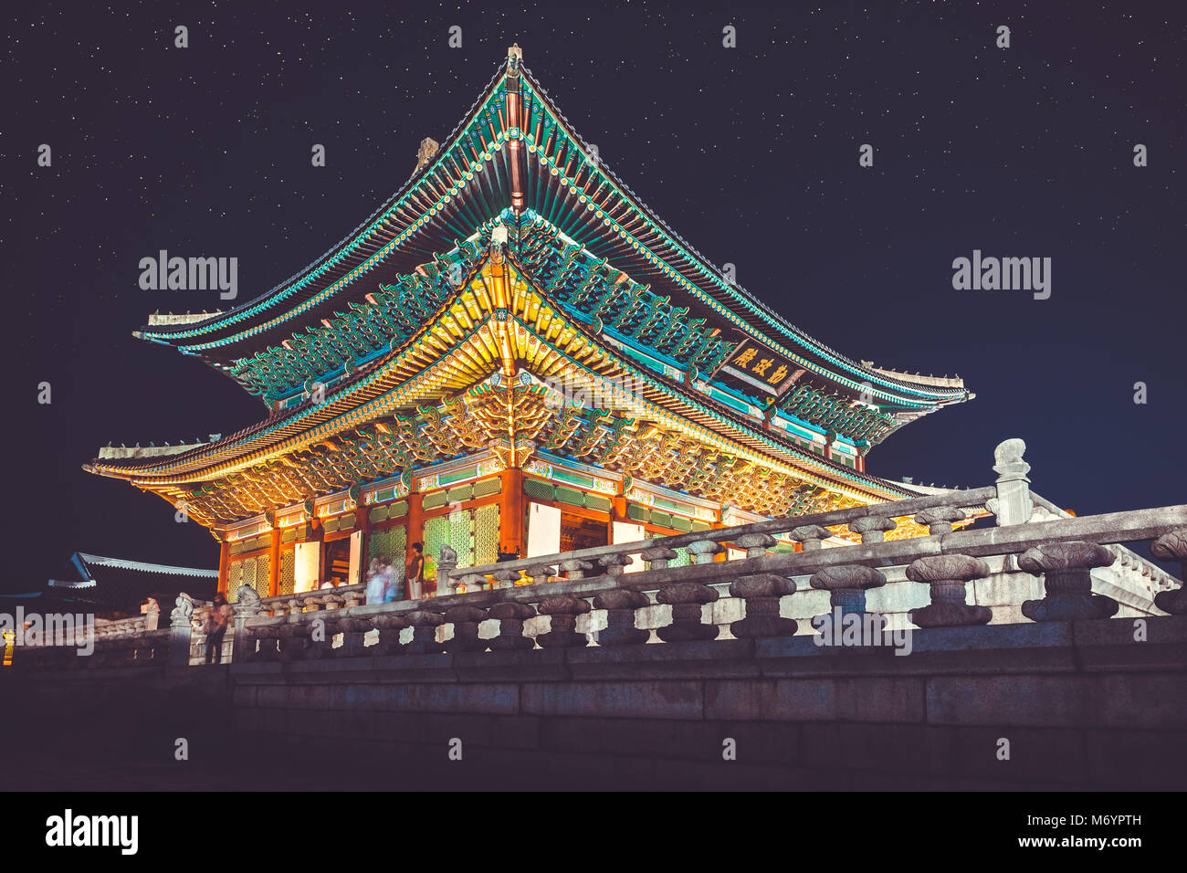 Gyeongbokgung palace at night with writing in chinese meaning ...