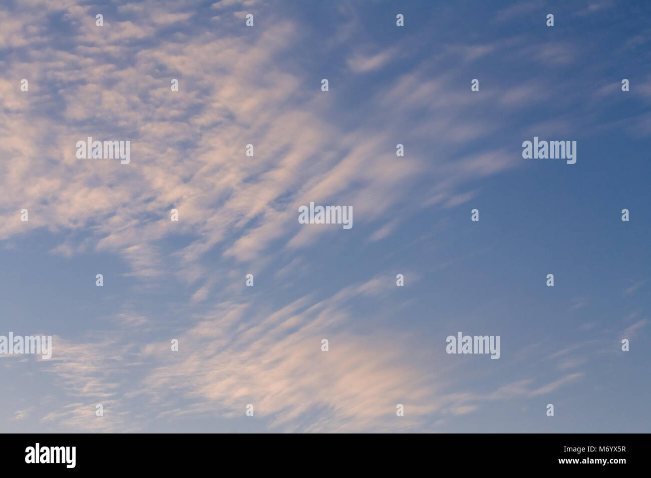 Blue evening sky with clouds during sunset Stock Photo - Alamy