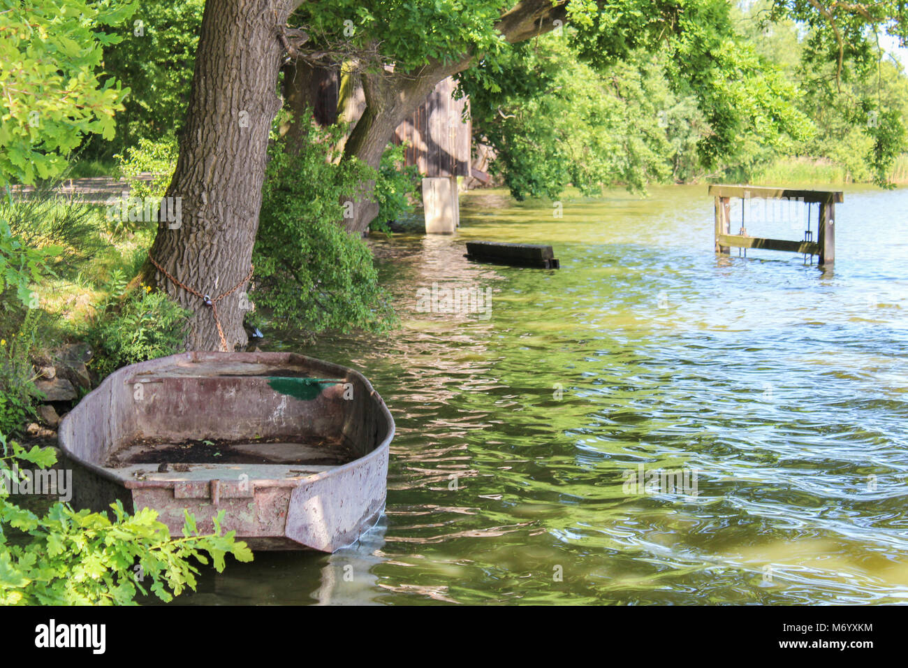 Old boat in pond hi-res stock photography and images - Alamy
