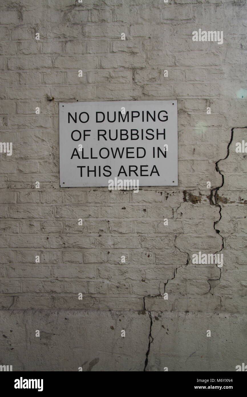 Dumping Prohibited Sign on brickwork brick wall in West London Stock ...