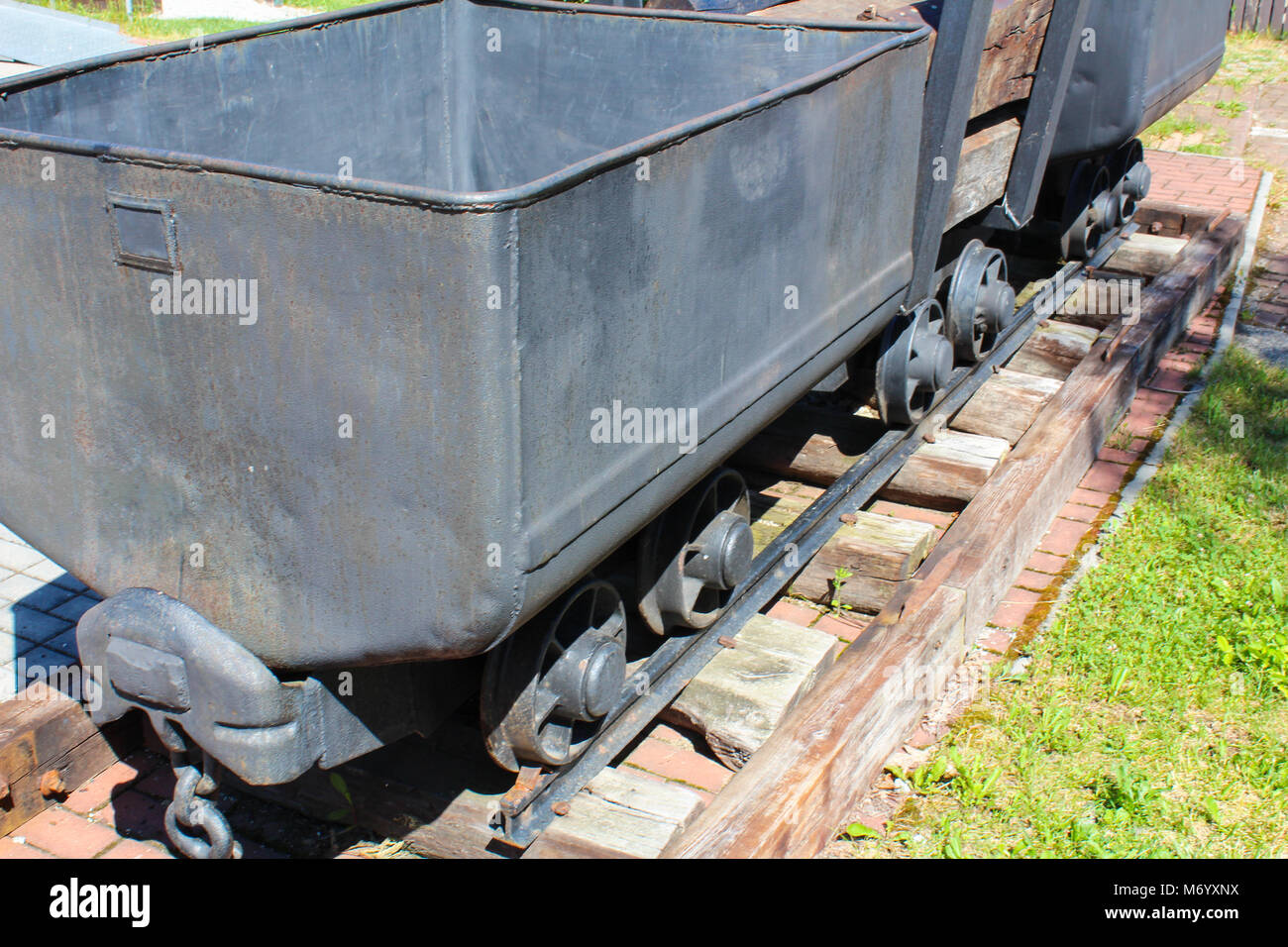 Mining cart on railway in village Usilne Stock Photo - Alamy
