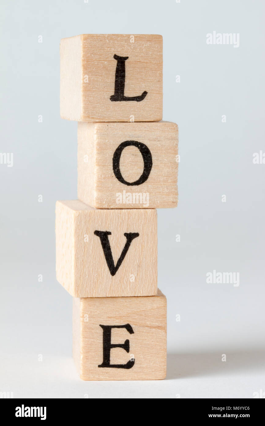 wooden cubes written as LOVE Stock Photo - Alamy