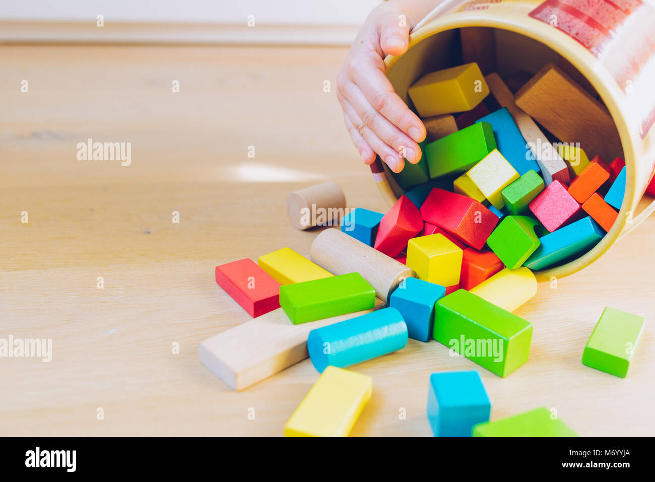 child playing with colorful wooden blocks - shallow depth of field ...
