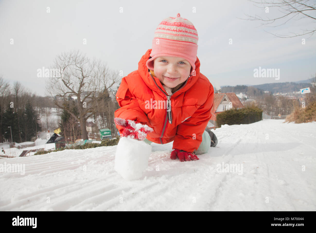 Kids enjoying snowy weather in winter time Stock Photo - Alamy