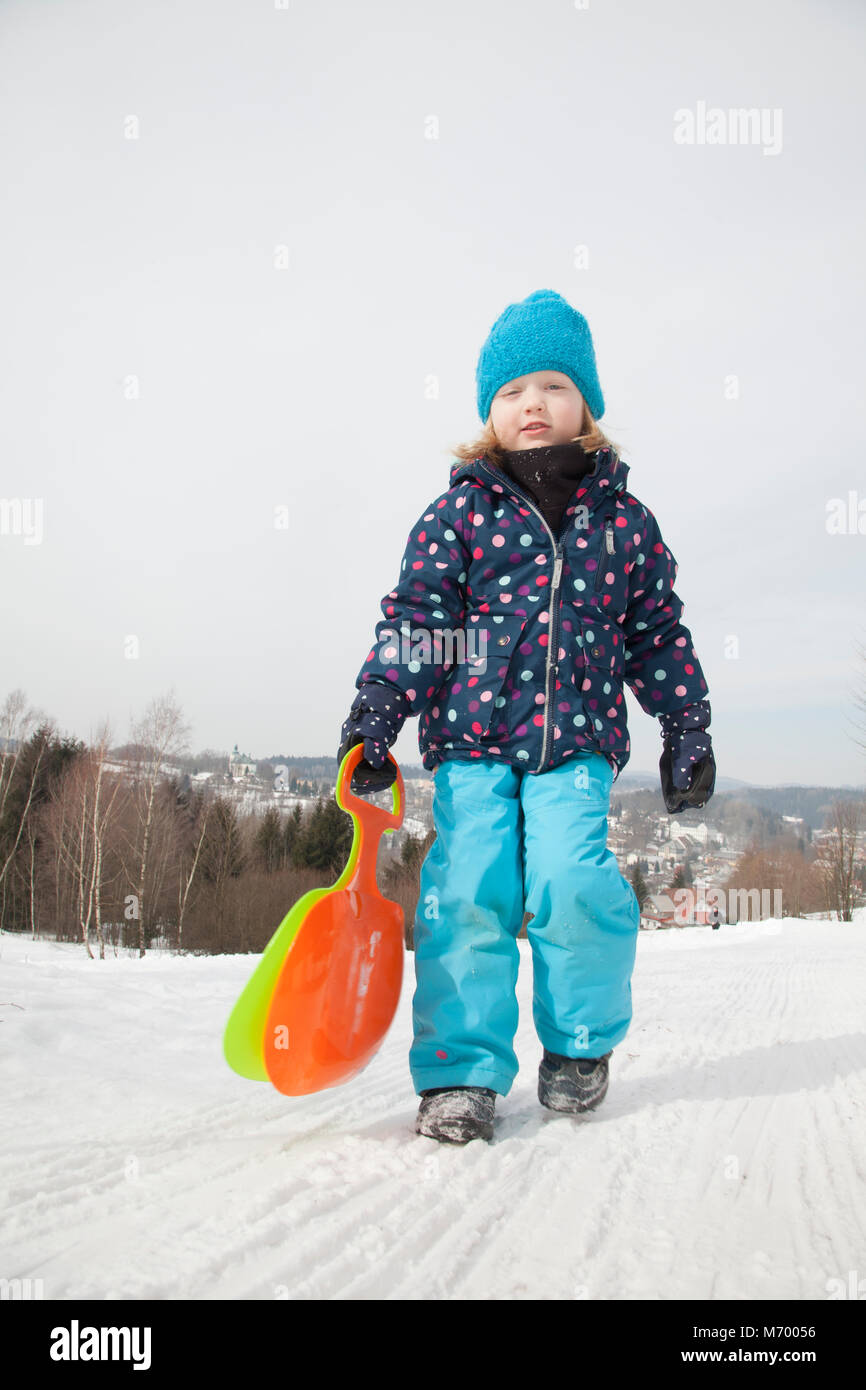 Kids enjoying snowy weather in winter time Stock Photo - Alamy