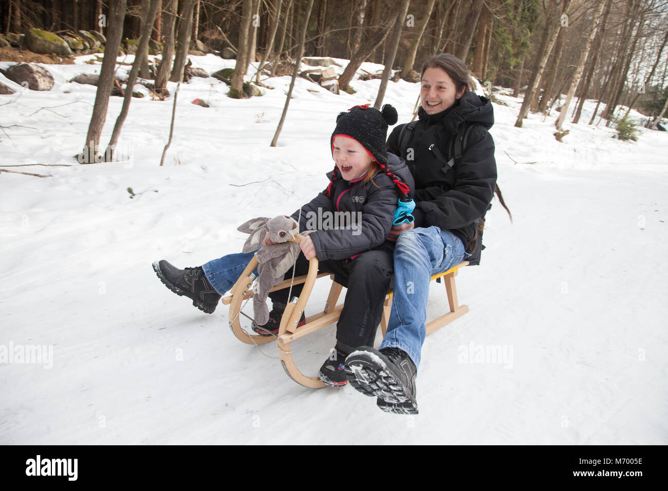Kids enjoying snowy weather in winter time Stock Photo - Alamy