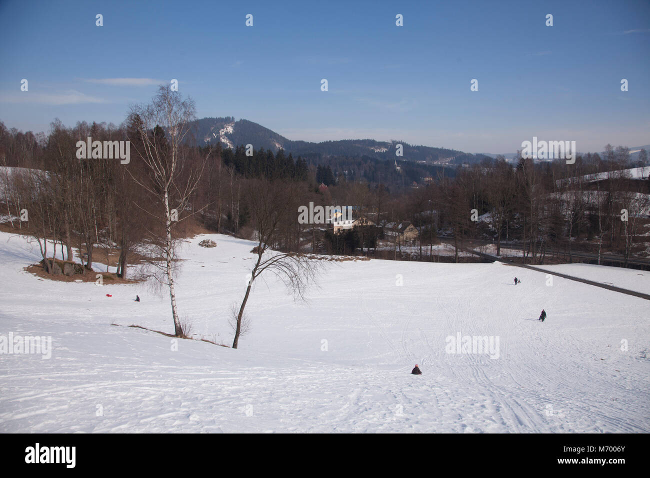 Kids enjoying snowy weather in winter time Stock Photo - Alamy