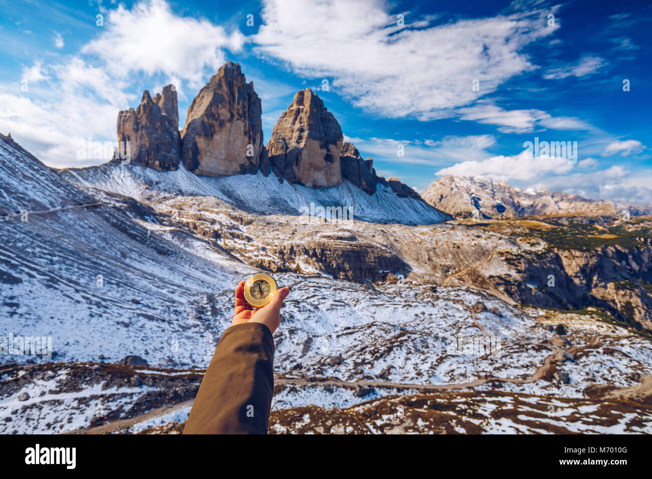 Explorer searching direction with compass in summer mountains, point of ...