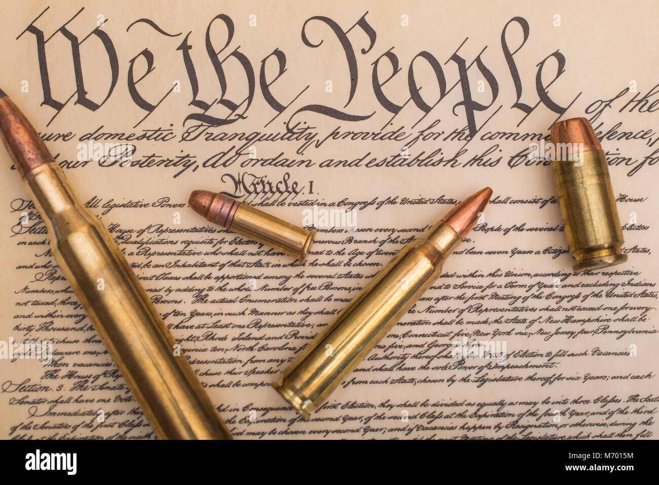 Different sizes of ammunition or bullets laying on the Constitution ...