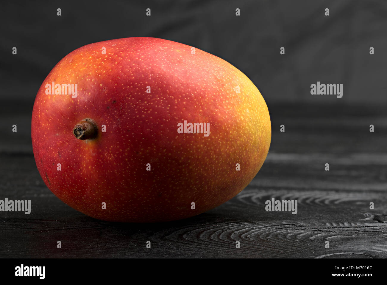 Fresh mango on black hi-res stock photography and images - Alamy