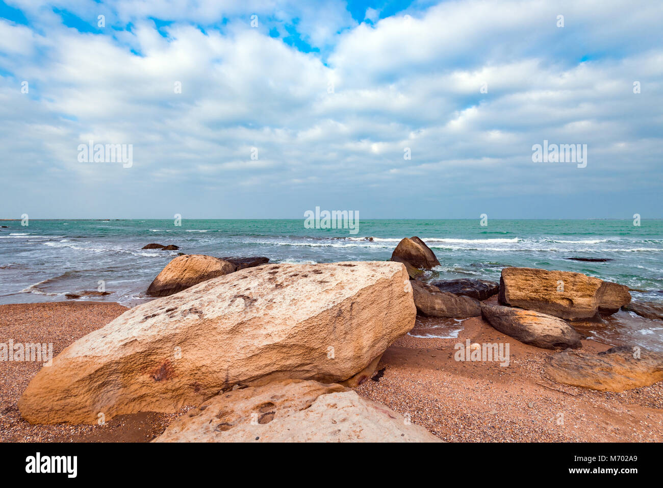 Golden sand turquoise ocean rocks hi-res stock photography and images ...