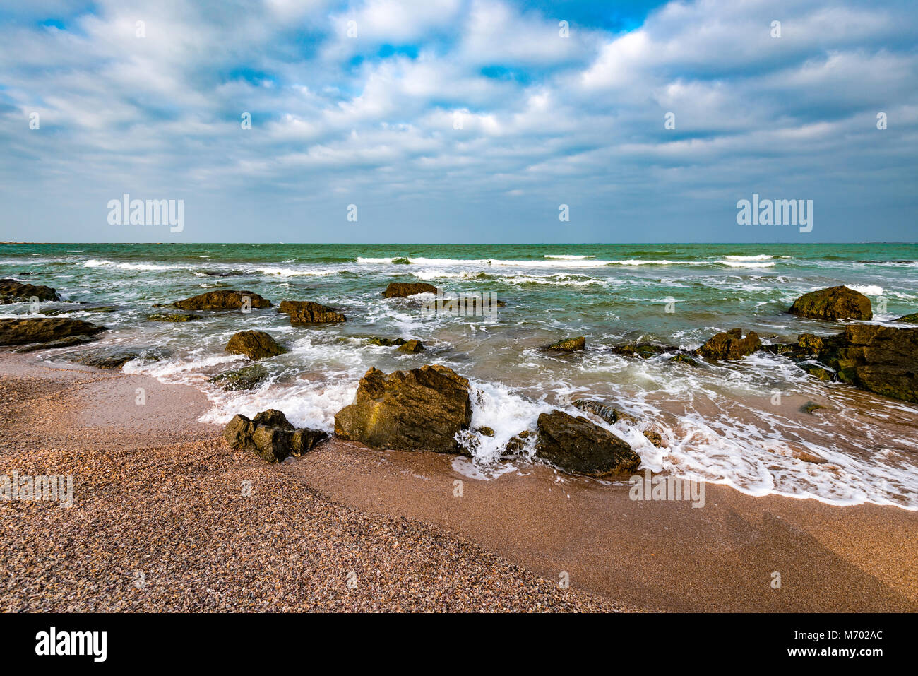 Golden sand turquoise ocean rocks hi-res stock photography and images ...