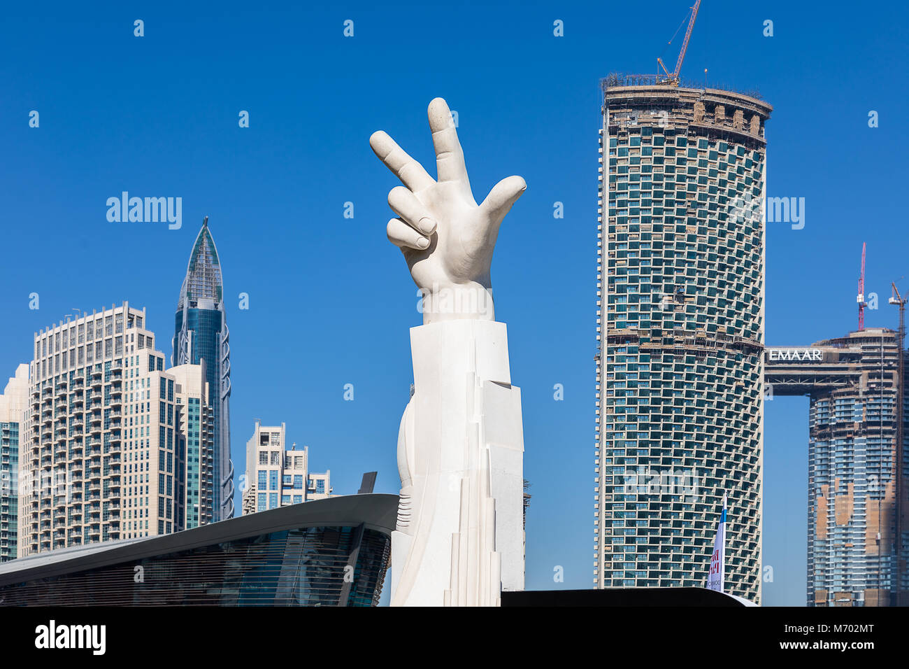 Three finger statue in Burj Khalifa Park in Dubai Stock Photo - Alamy