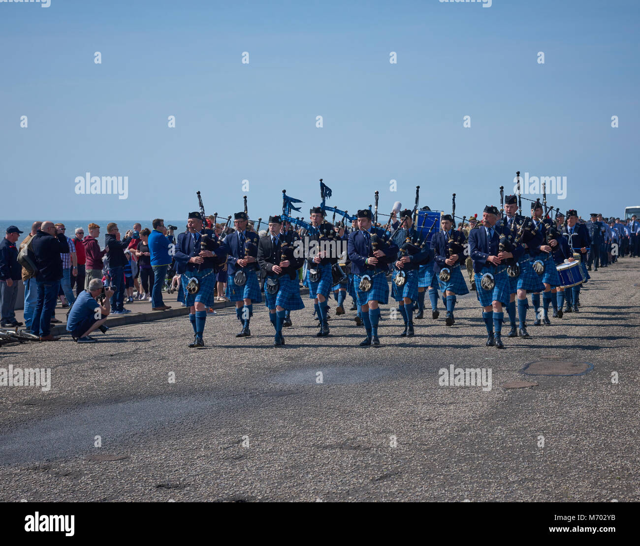 People watching a Pipe Band marching at the Festival For Hero's public ...