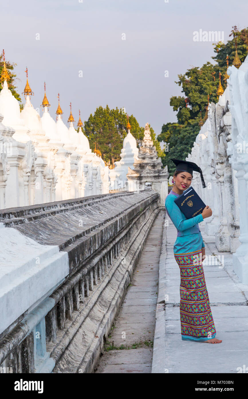 young woman posing for graduation photo at Kuthodaw Pagoda, Mandalay ...