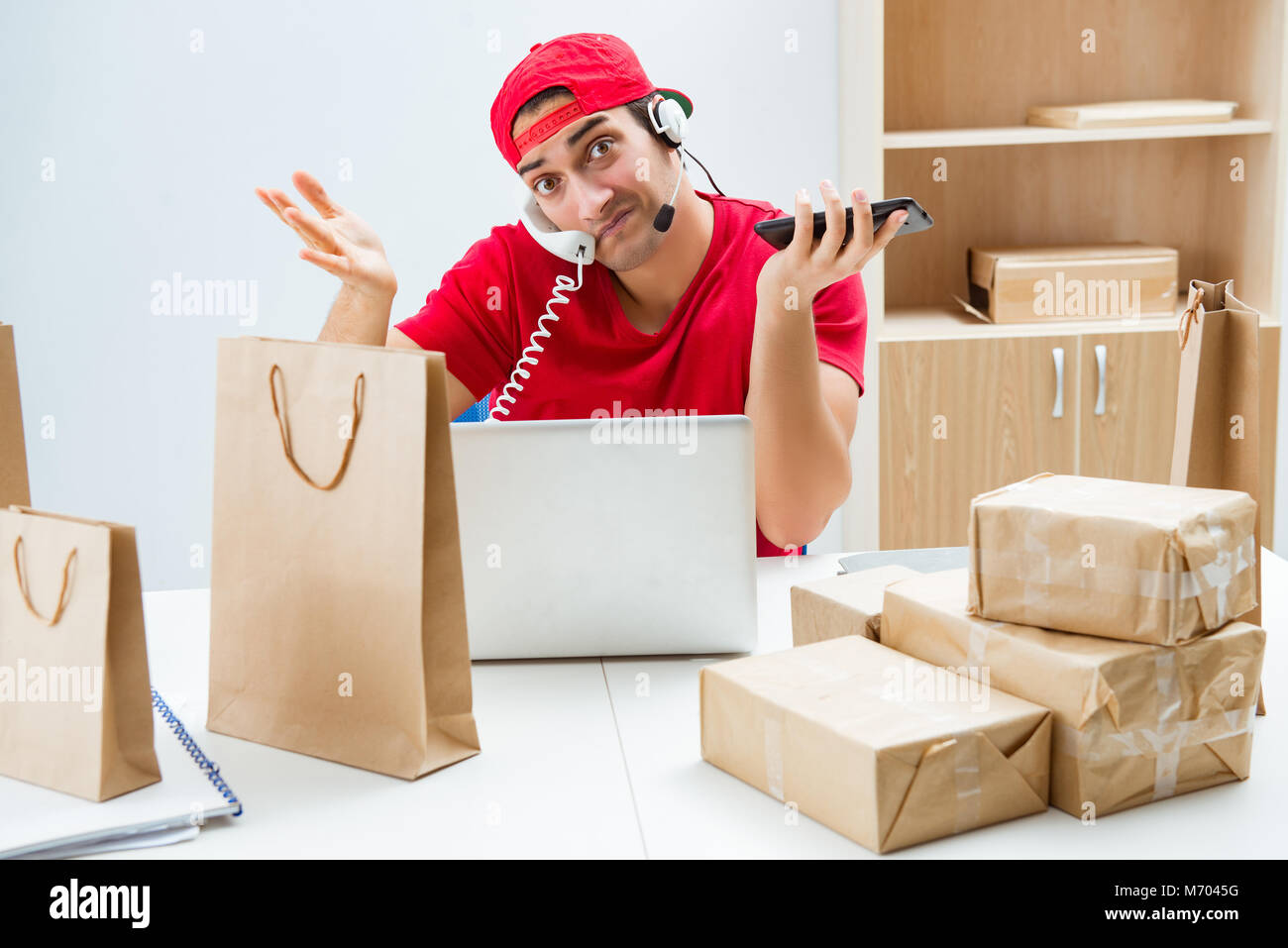 Call center worker at parcel distribution center in post office Stock ...