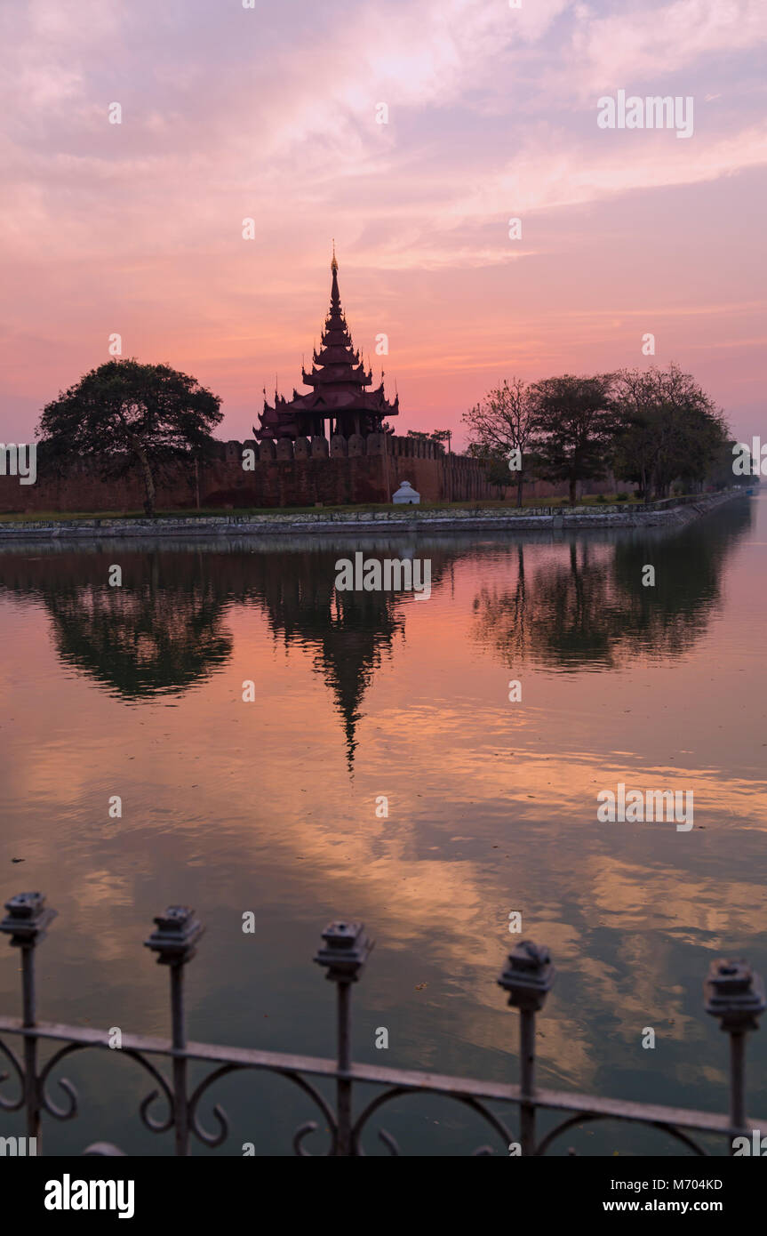 Moat bastion and city wall of Mandalay Royal Palace at sunset with ...