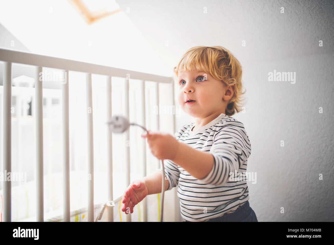 Toddler boy in a dangerous situation at home Stock Photo - Alamy